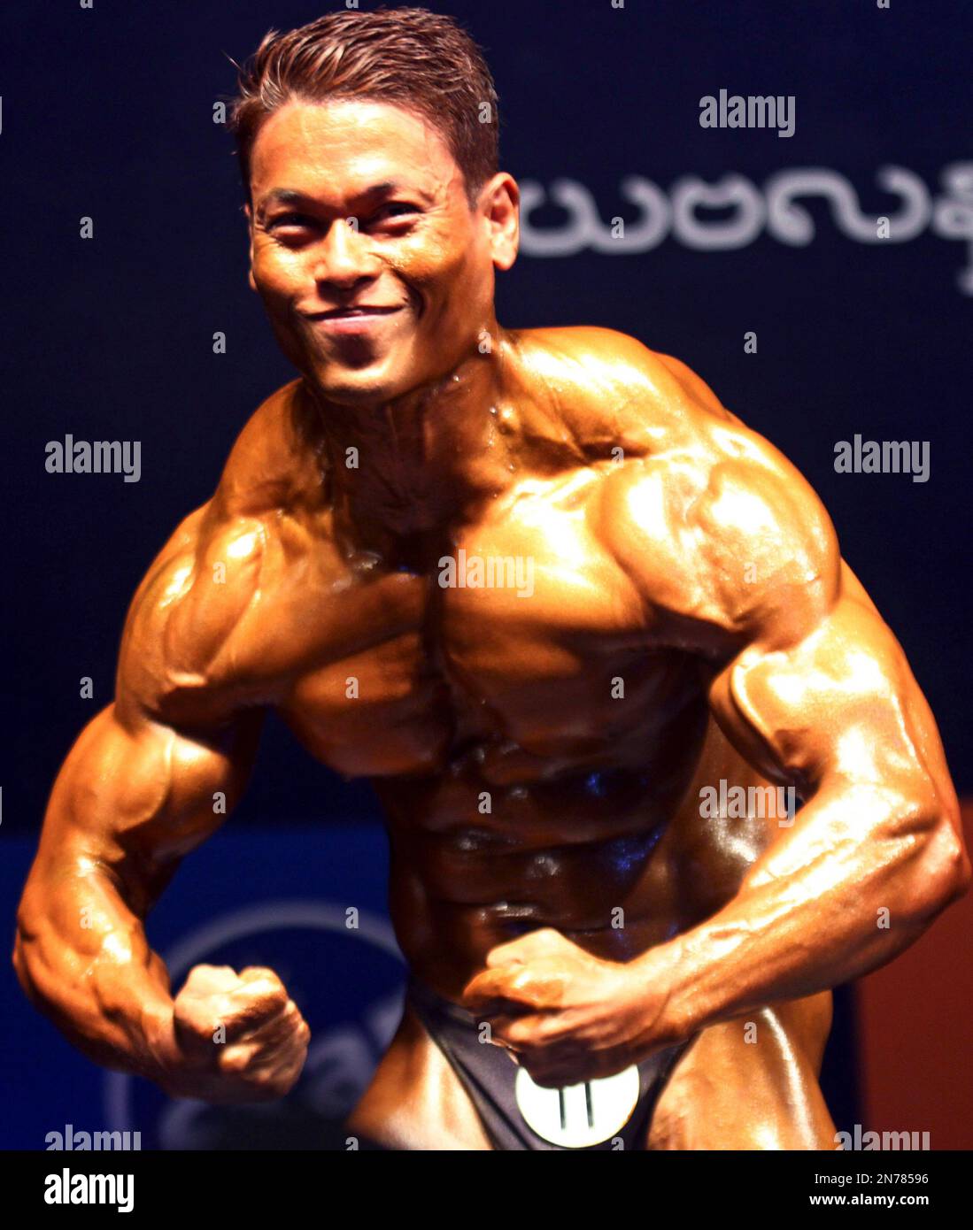 A bodybuilder competes during their bodybuilding contest organized by ...