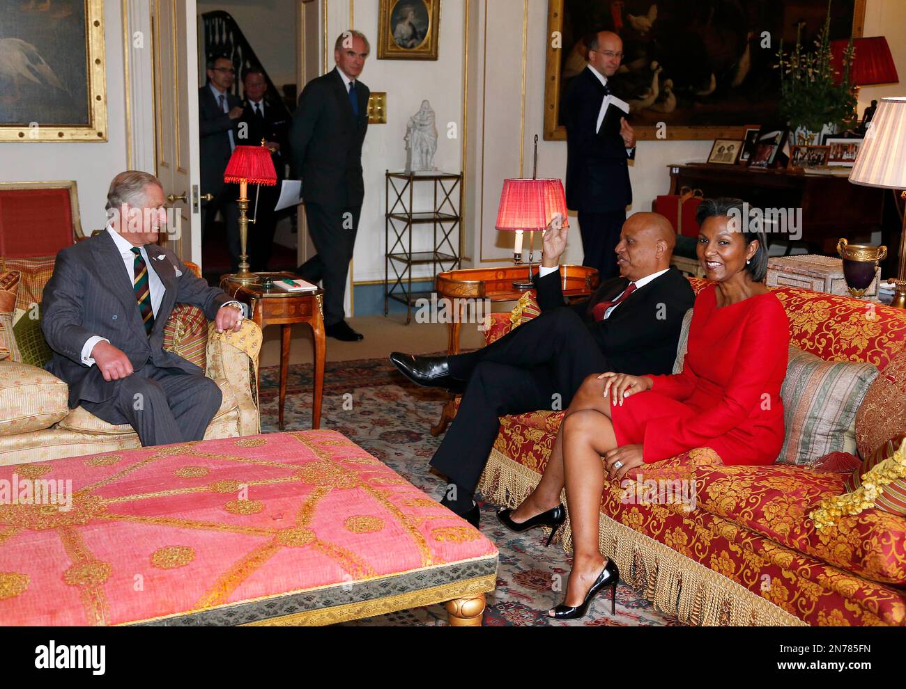 Britain's Prince Charles, right, welcomes the Prime Minister of Belize ...