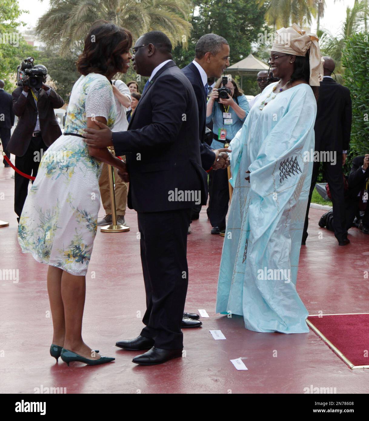 U.S. President Barack Obama, second right, is greeted Senegalese First ...