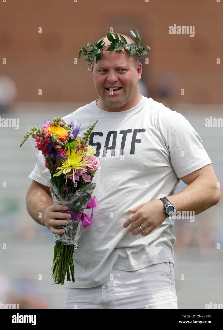 American shot putter Adam Nelson reacts to the crowd after being ...