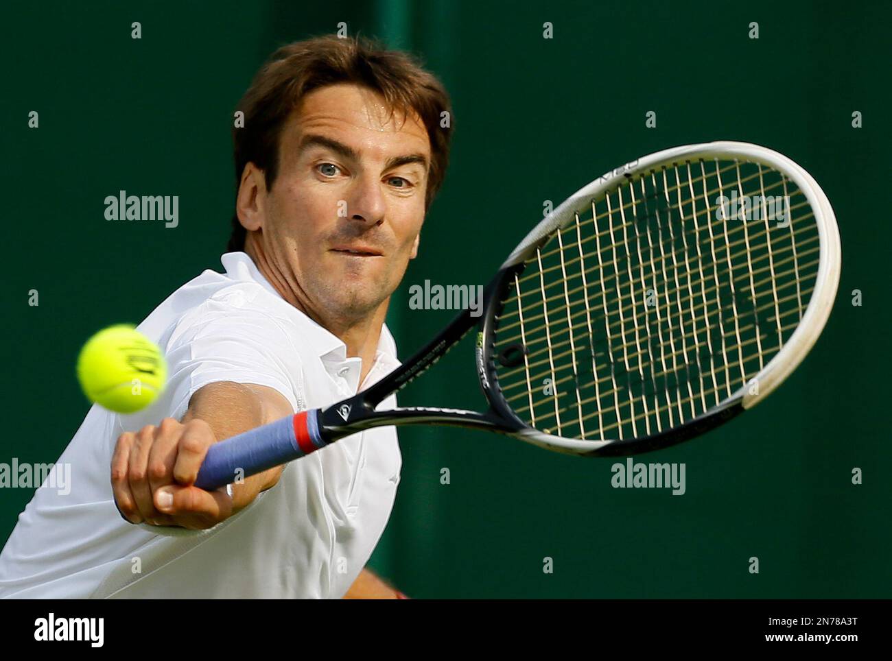 Tommy Robredo of Spain returns to Nicolas Mahut of France during their ...