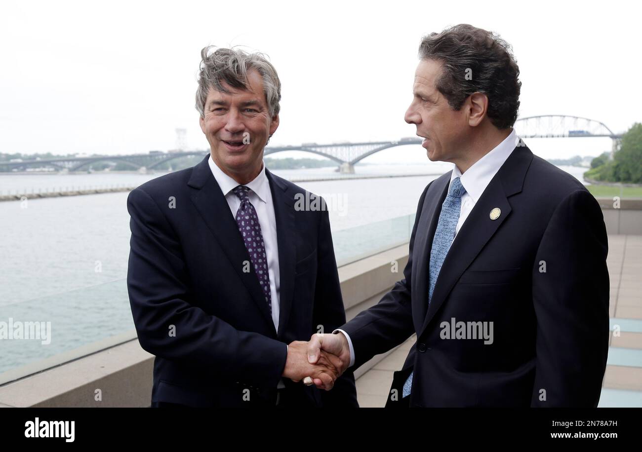 New York Gov. Andrew Cuomo, right, shakes hands with Ambassador Gary ...