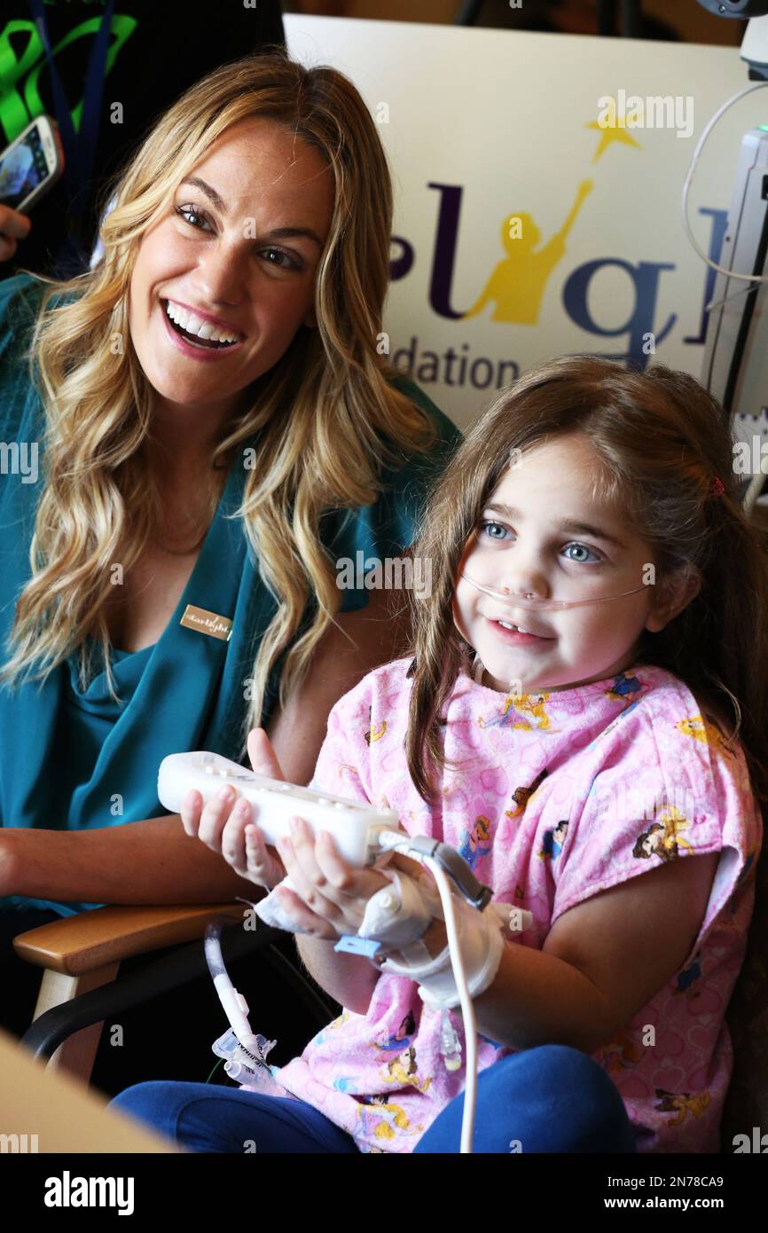 Ashland Gorse visits with patients at Colgate-Palmolive donation of a ...