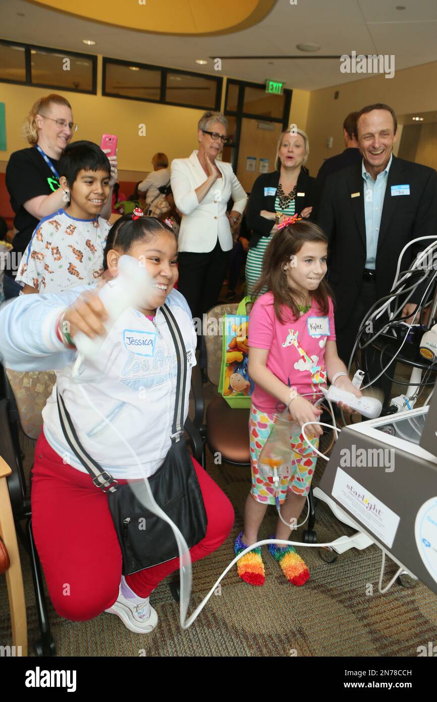 Patients enjoying the Nintendo Wii at Colgate-Palmolive donation of a ...