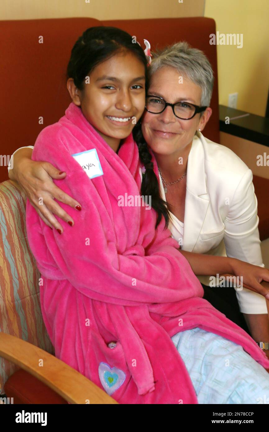 Jamie Lee Curtis visiting with a patient at Colgate-Palmolive donation ...