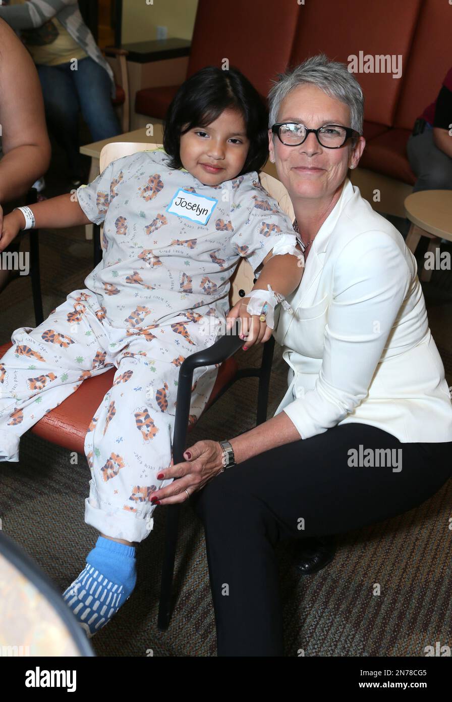Jamie Lee Curtis visiting with a patient at Colgate-Palmolive donation ...