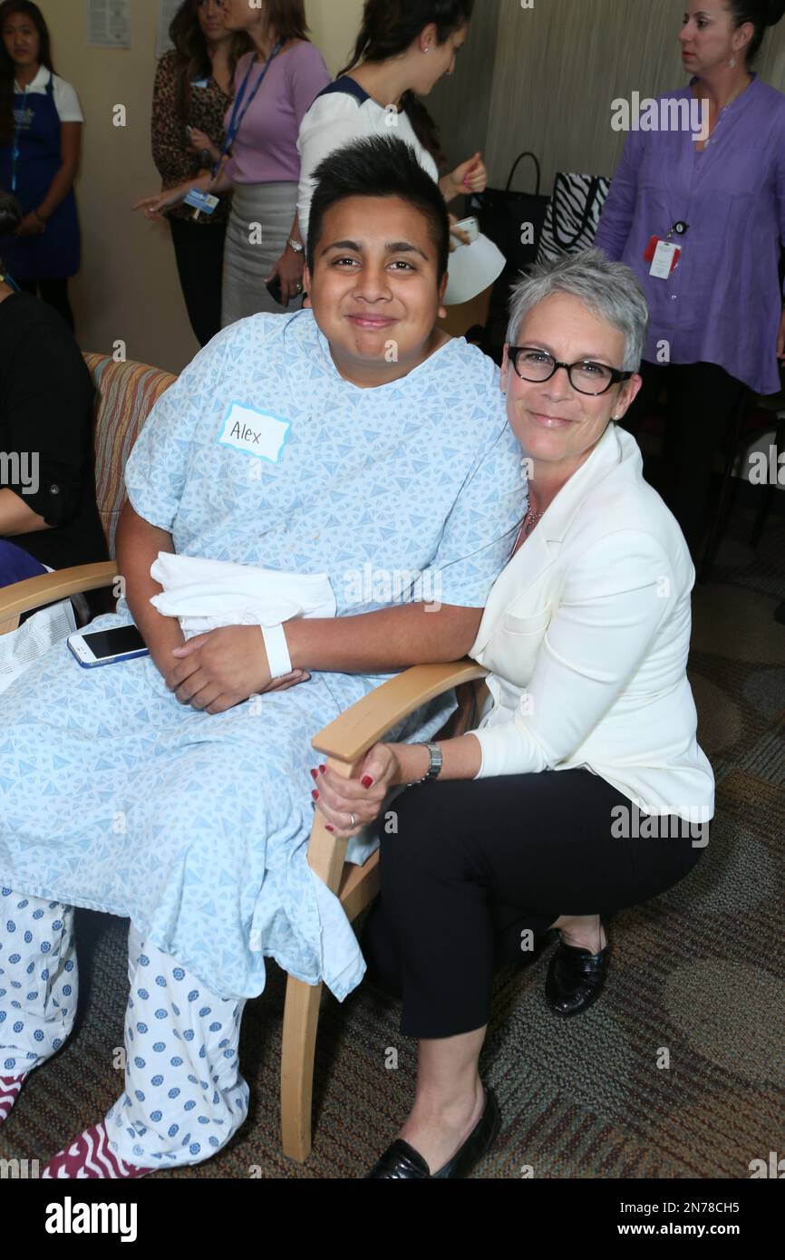 Jamie Lee Curtis visiting with a patient at Colgate-Palmolive donation ...