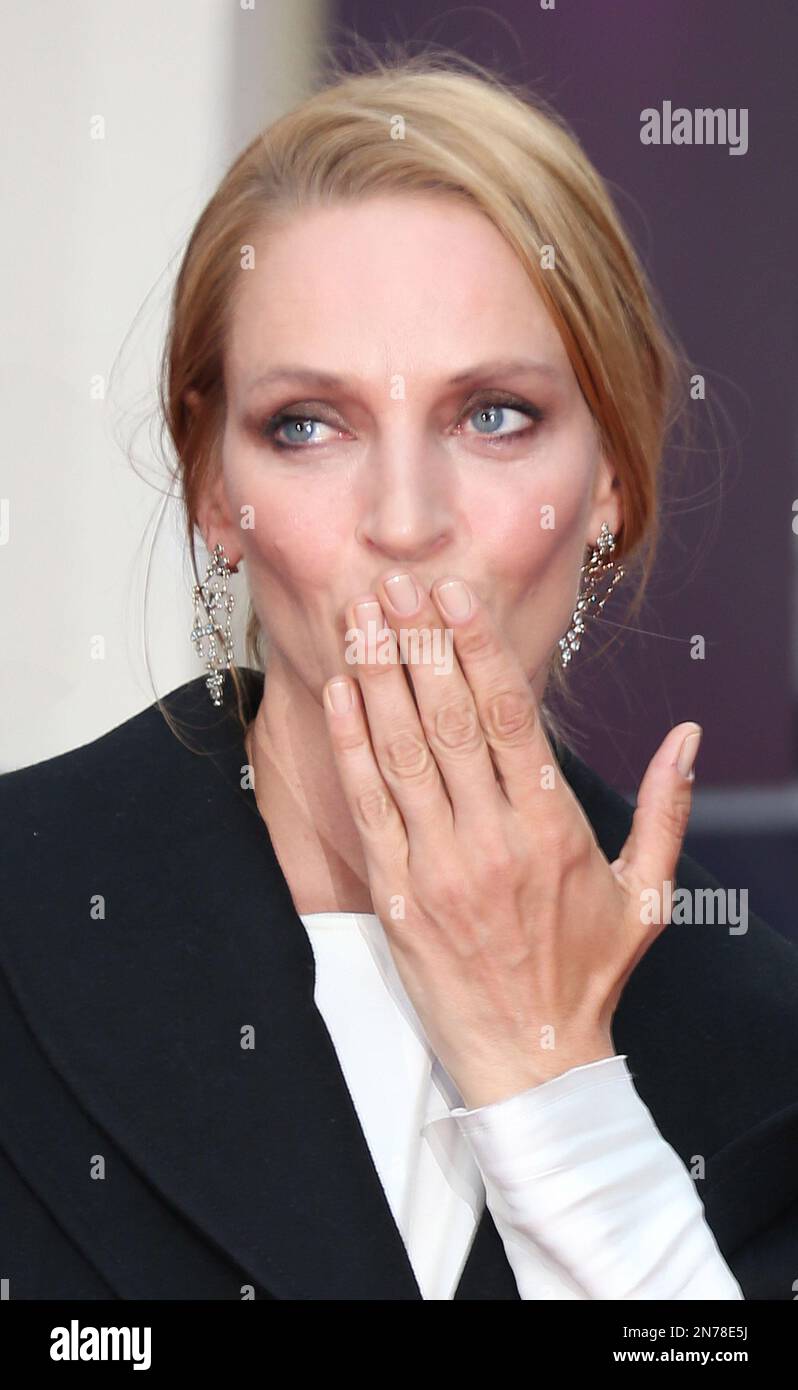Uma Thurman gestures, as she arrives for the opening night of Charlie ...