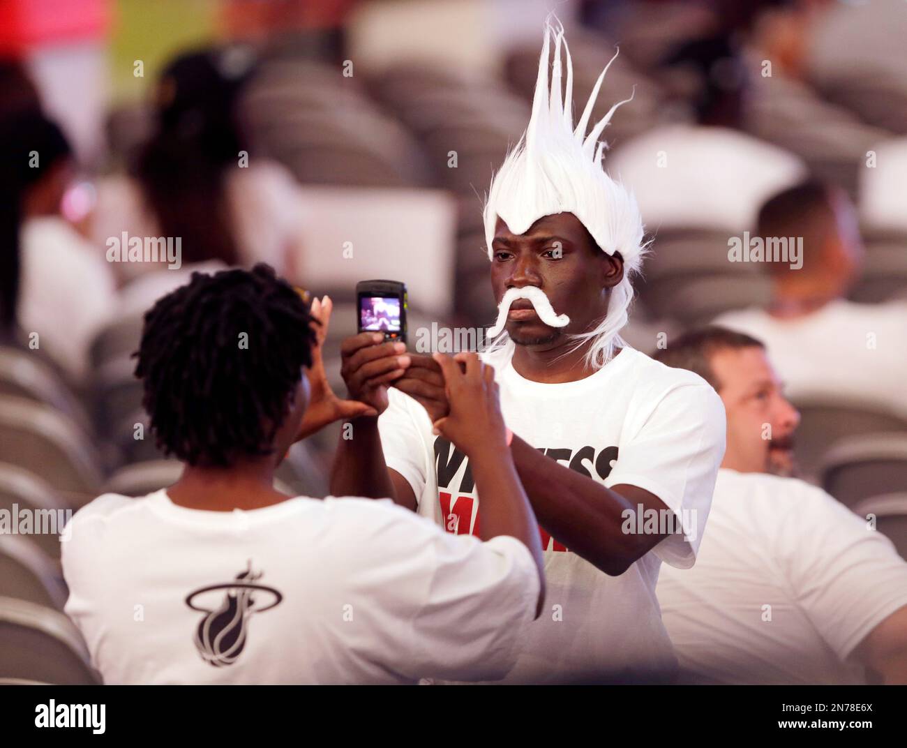 Miami Heat fans take photos of themselves, Monday, June 24, 2013 during ...