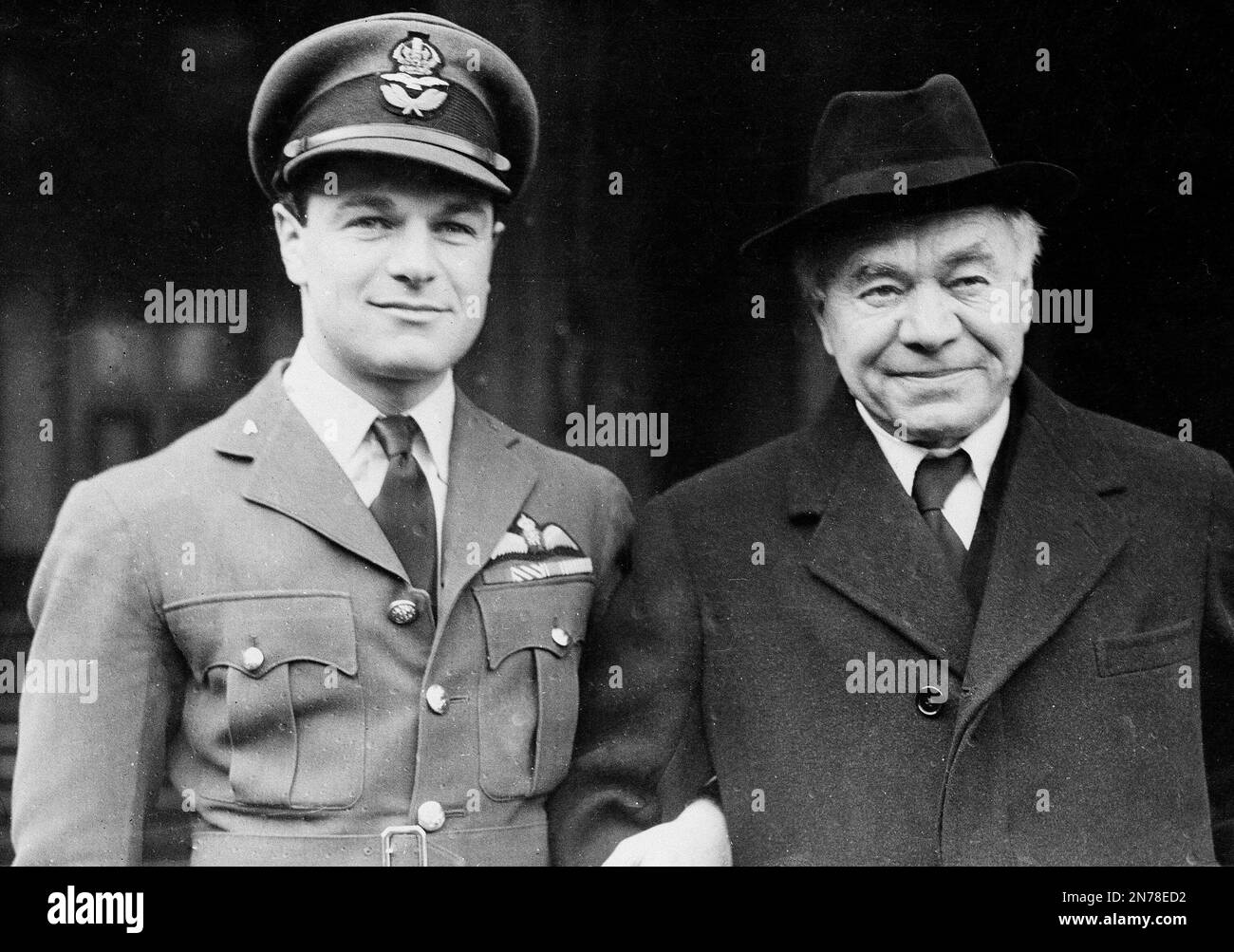 Wing-commander the Hon. Max Aitken, left, leaving Buckingham Palace ...