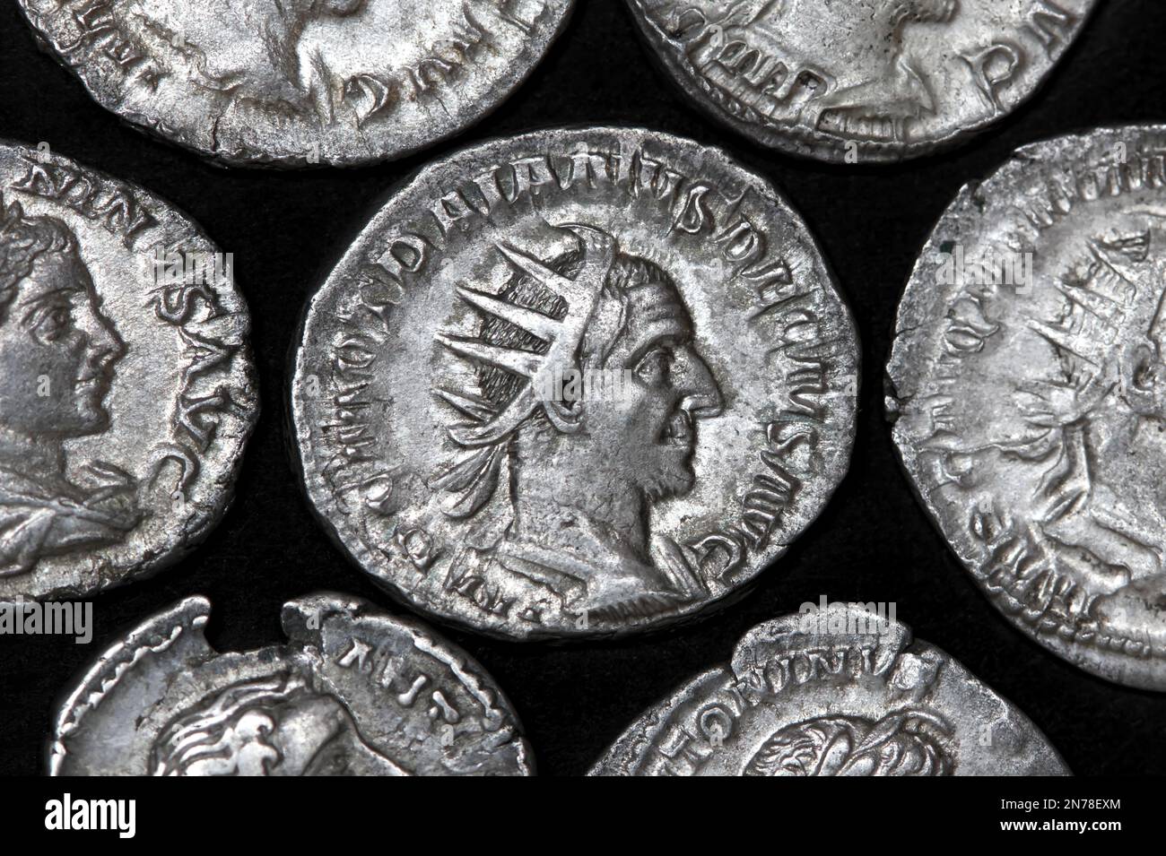 Isolated ancient roman coins with a black background showing face of ...