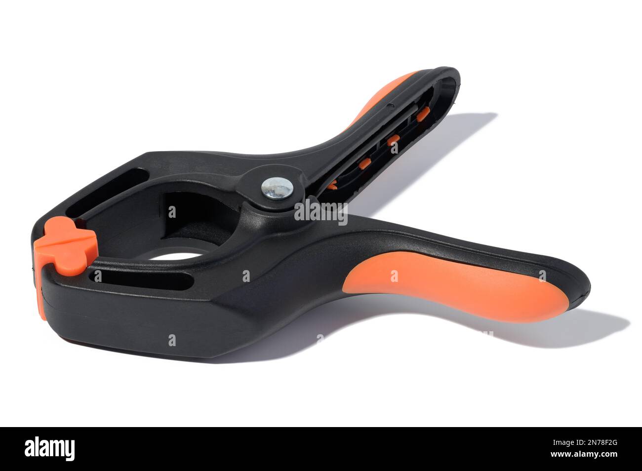 Large plastic clamp on a white isolated background Stock Photo - Alamy