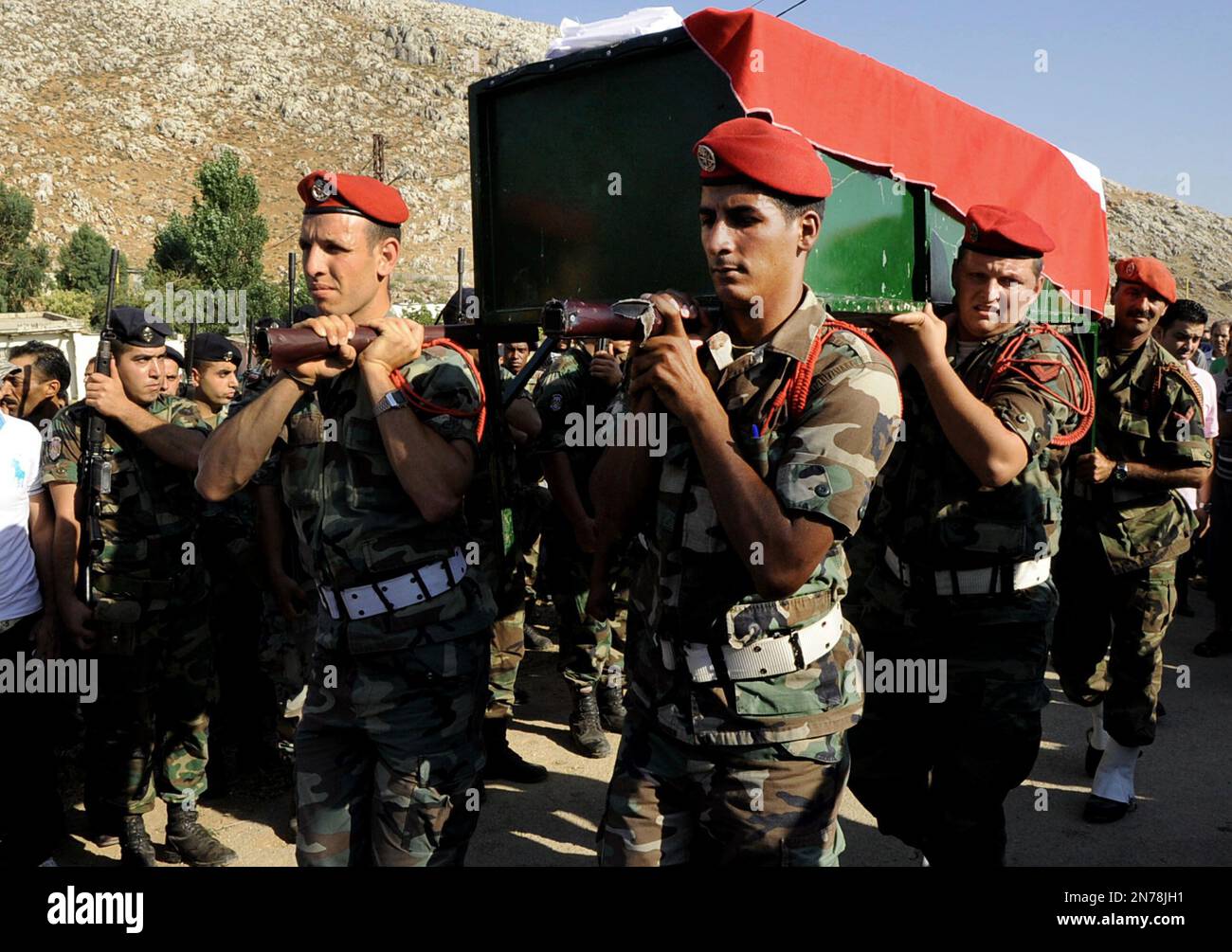 Lebanese army soldiers from military police unit, carry the coffin of ...