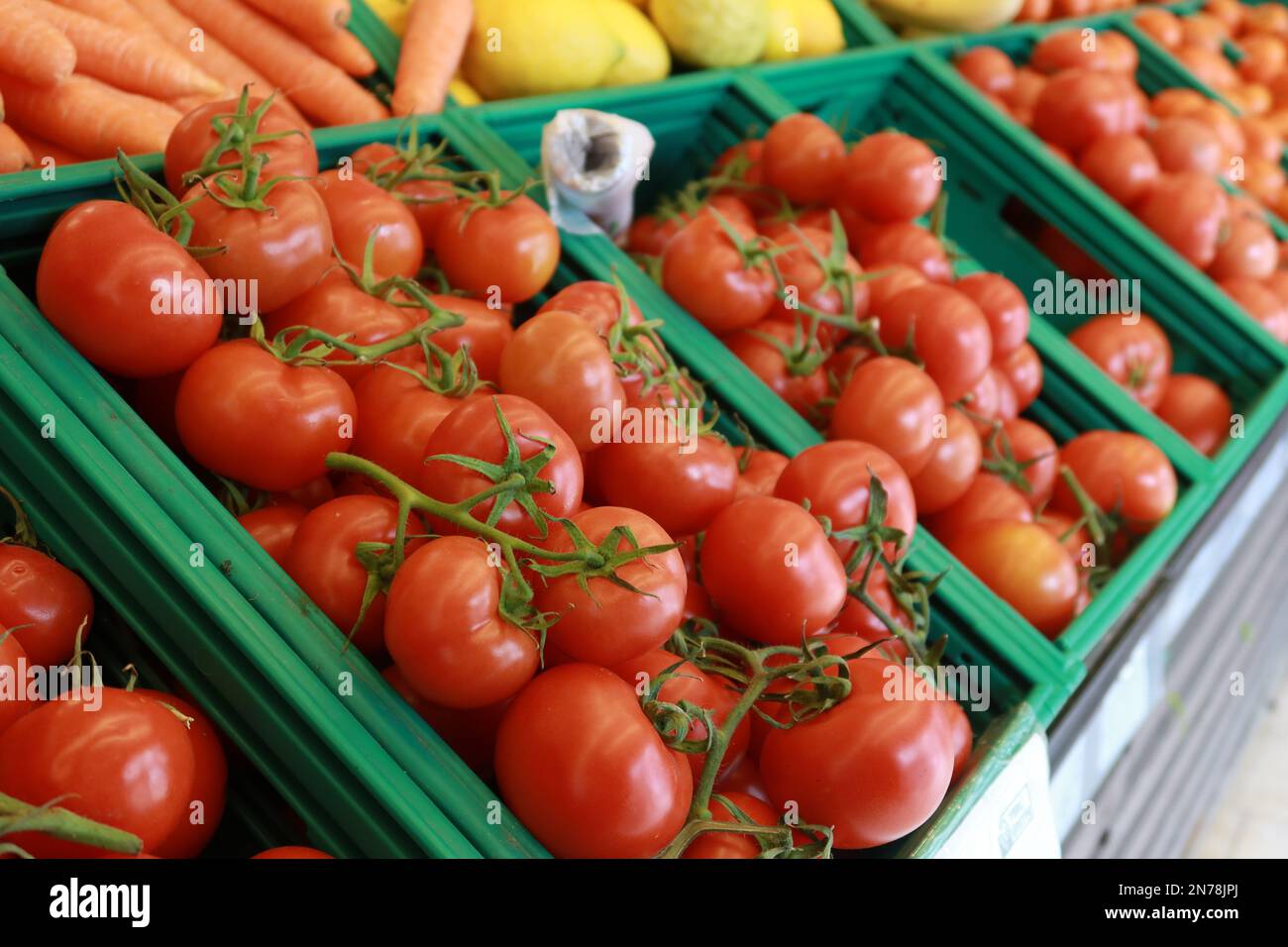 fresh tomato display for sale at local store Stock Photo - Alamy