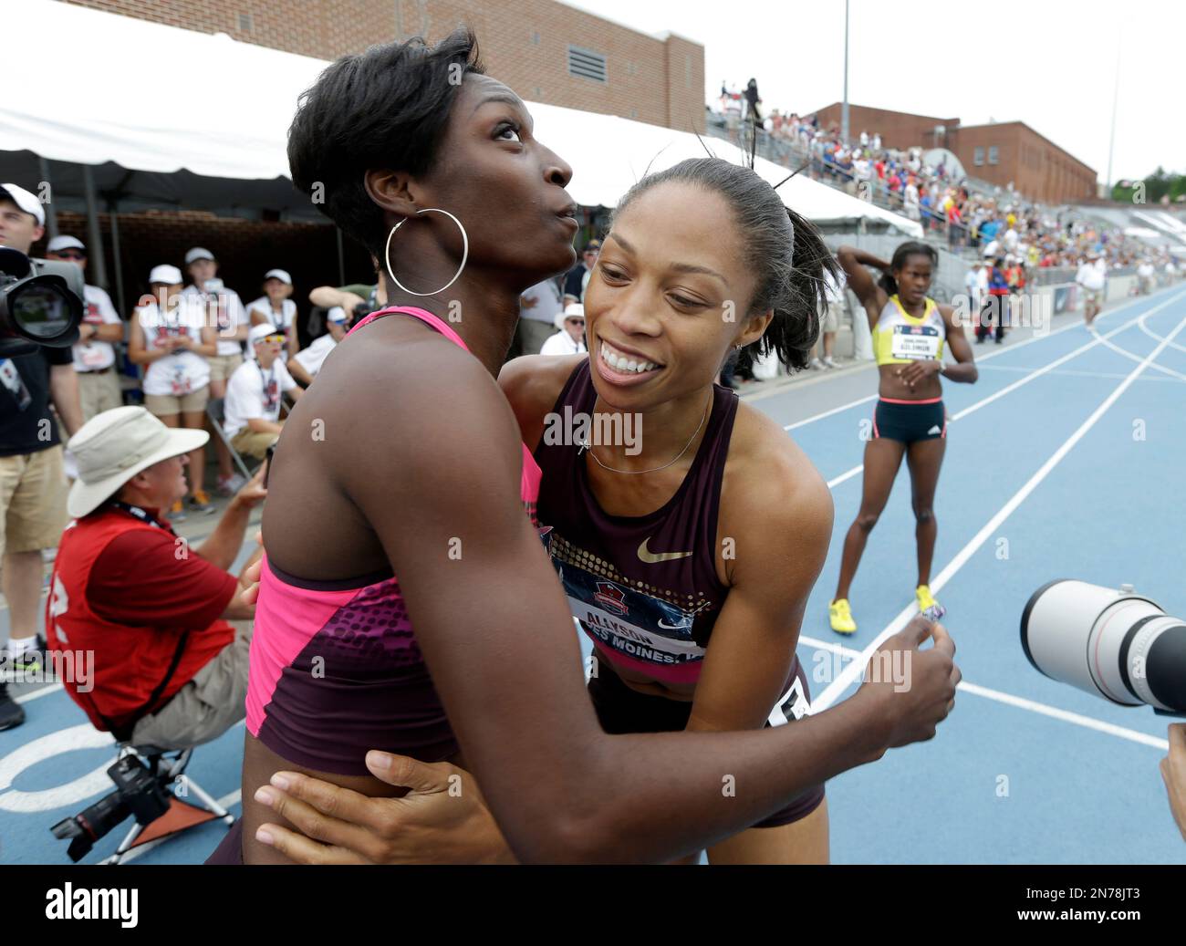 Kimberlyn Duncan, left, gets a hug from Allyson Felix after winning the ...