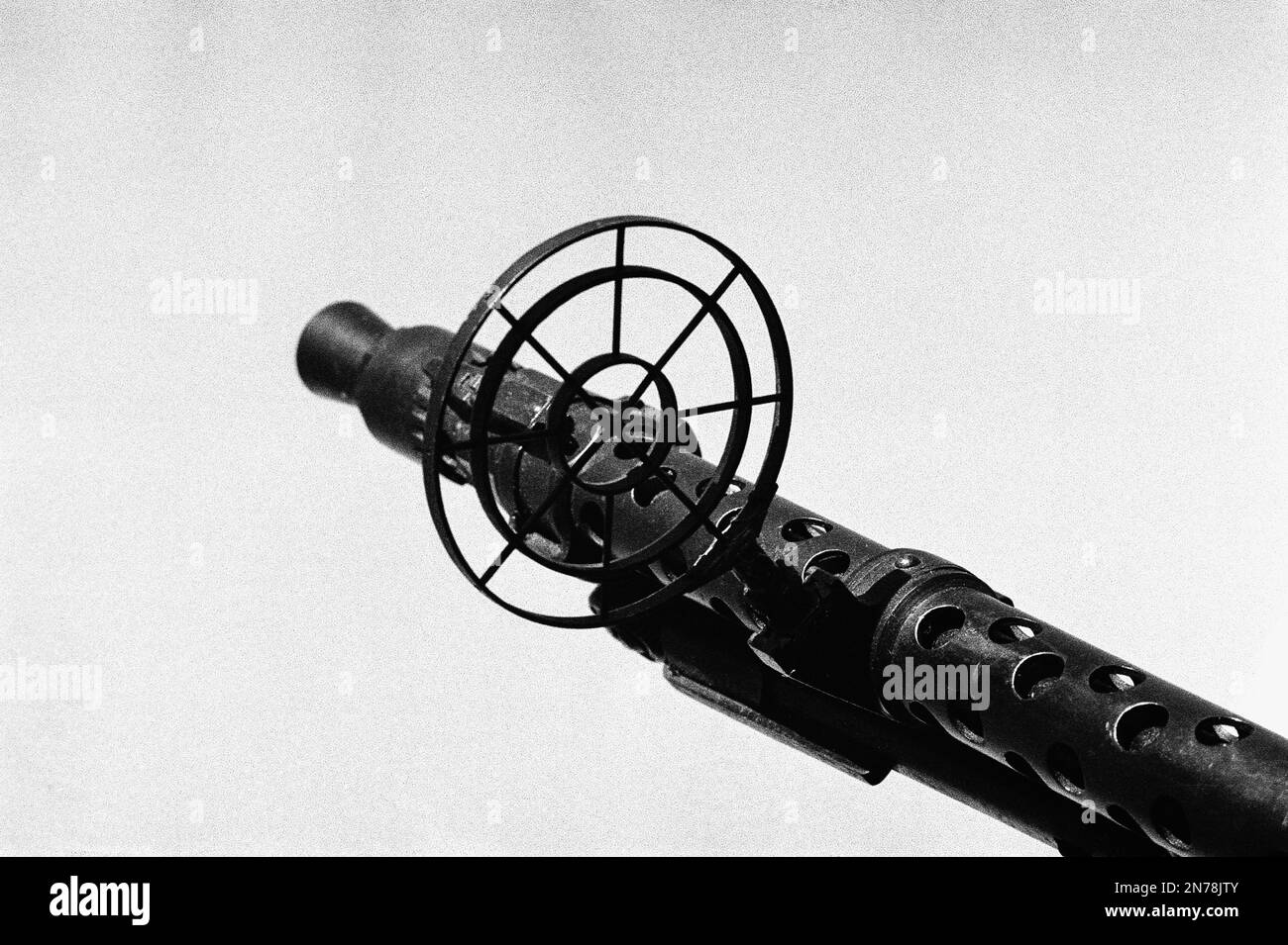 The sight of an anti-aircraft gun pointed to the sky during a WWII ...