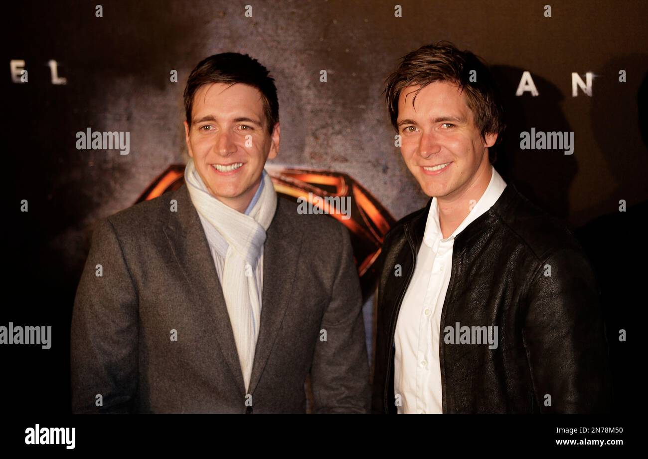 Actors James, left, and Oliver Phelps walk the red carpet for the ...