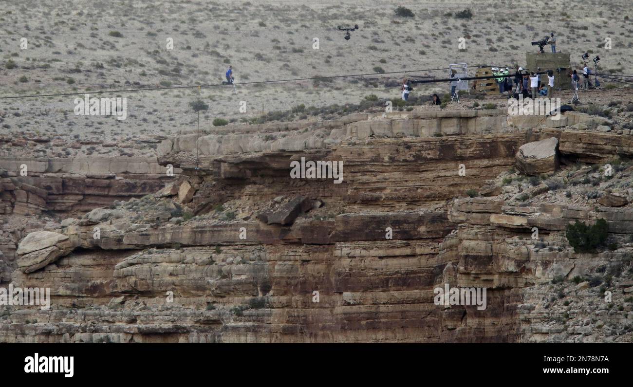 Daredevil Nik Wallenda crosses a tightrope 1,500 feet above the Little ...