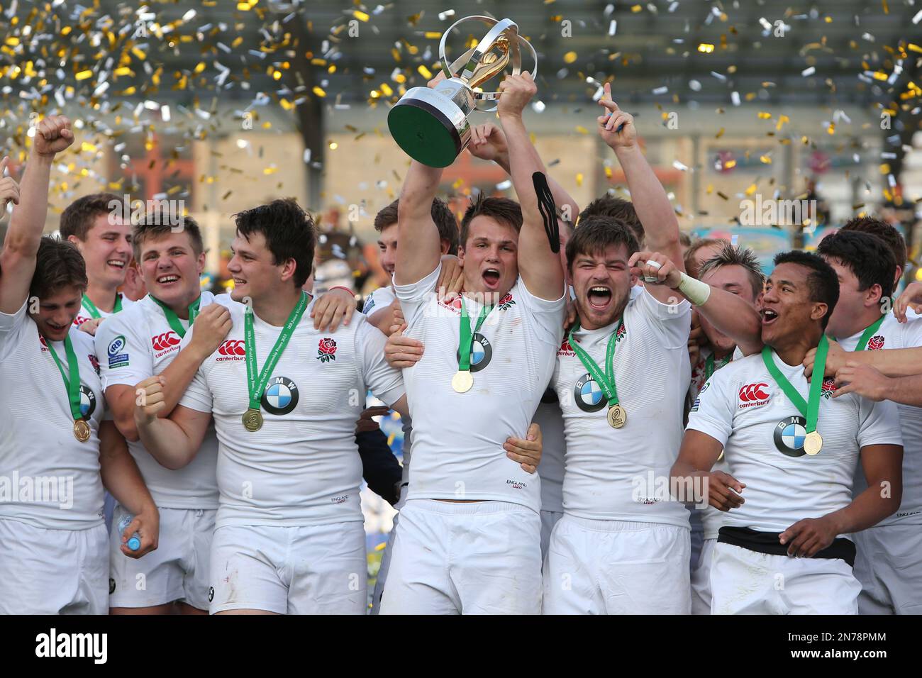 Jack Clifford, captain of England's Team, displays the trophy, after ...