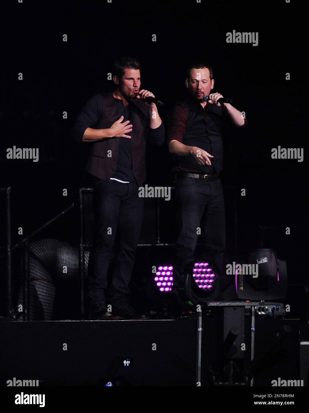 Nick Lachey and Justin Jeffre of 98 Degrees perform during The Package ...