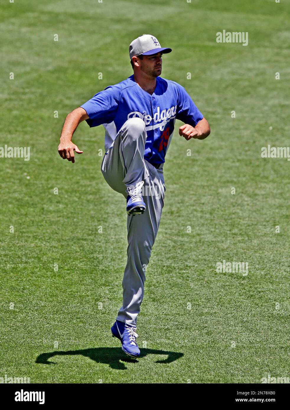 Los Angeles Dodgers starting pitcher Ted Lilly high steps his way ...