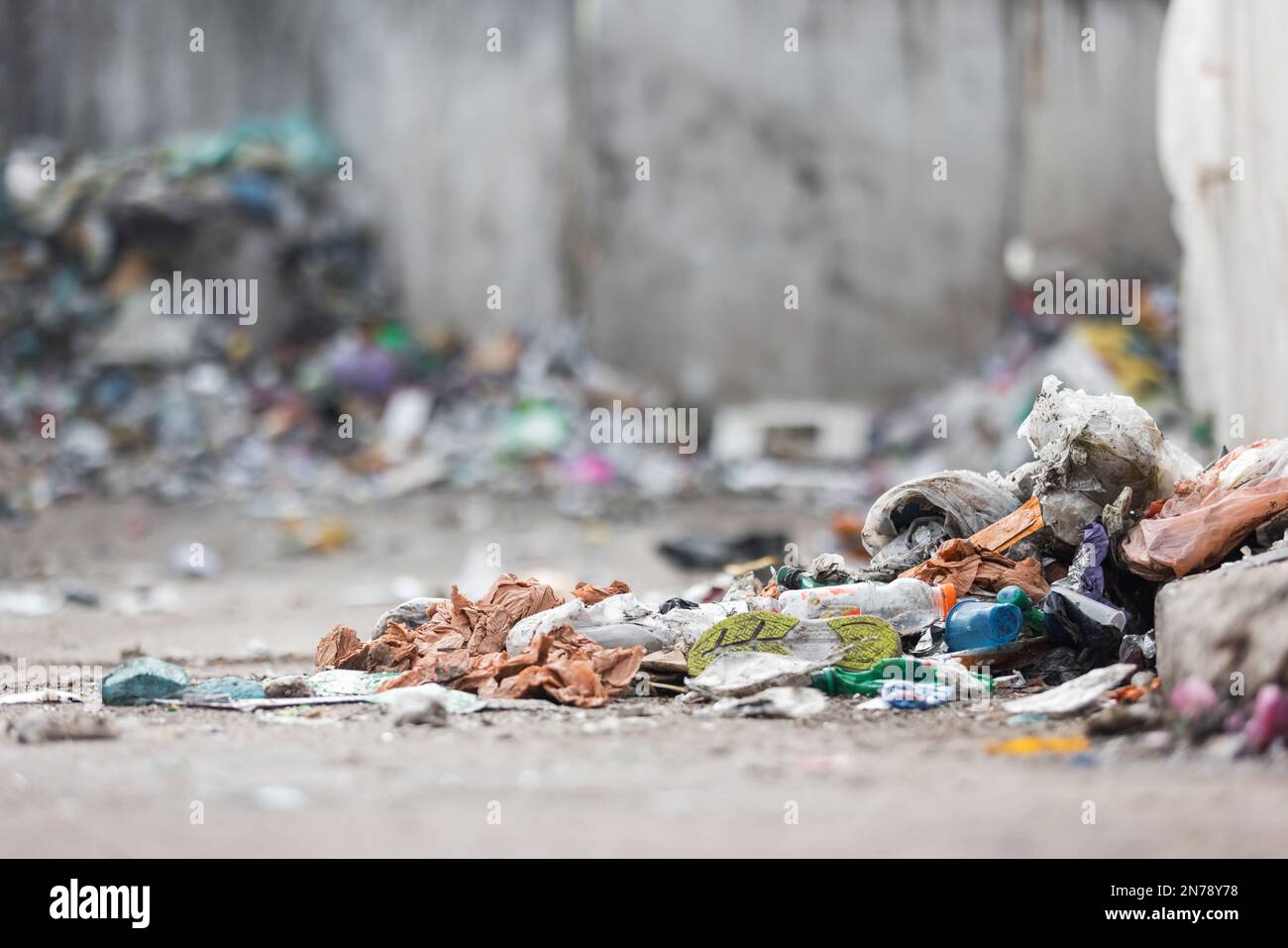 Landfill site, a pile of stinky different junk disposal in the concrete ...