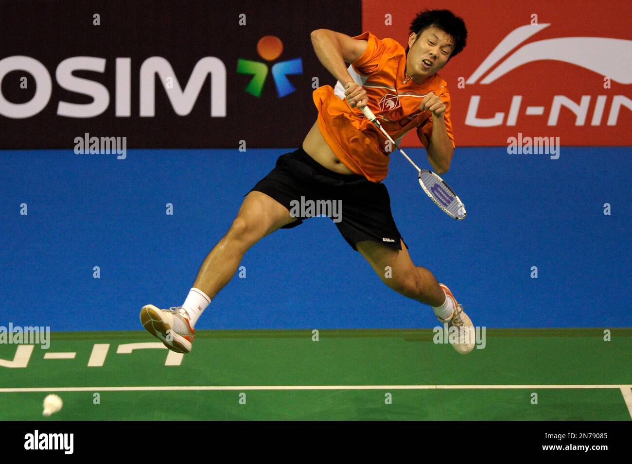 Thailand's Boonsak Ponsana returns a shot to Japan's Yakuma Ueda in ...
