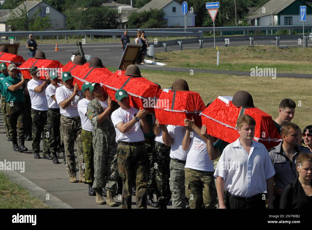 People carry the coffins with remains of Soviet soldiers killed ...
