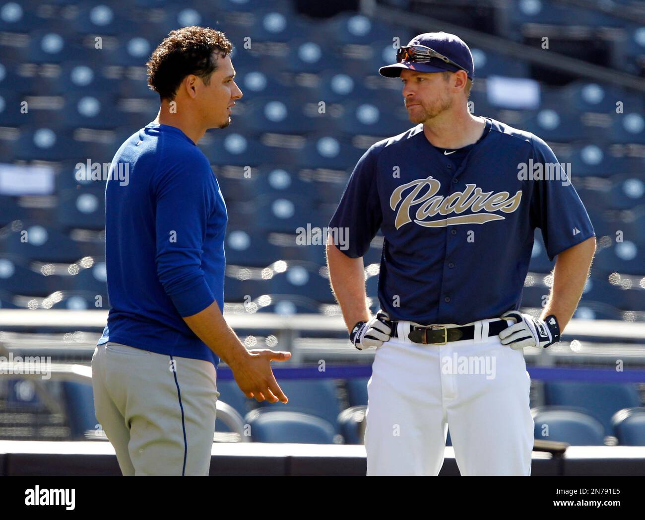 Los Angeles Dodgers third baseman Luis Cruz, left, talks with San Diego ...