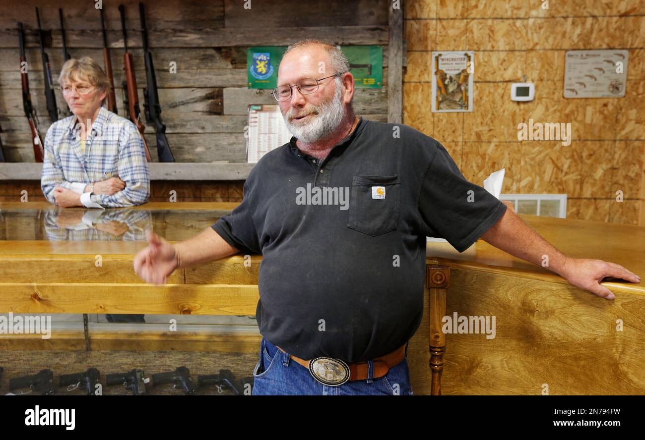 Jim and Arlena Sowash stand in their gun shop near Stover, Mo ...