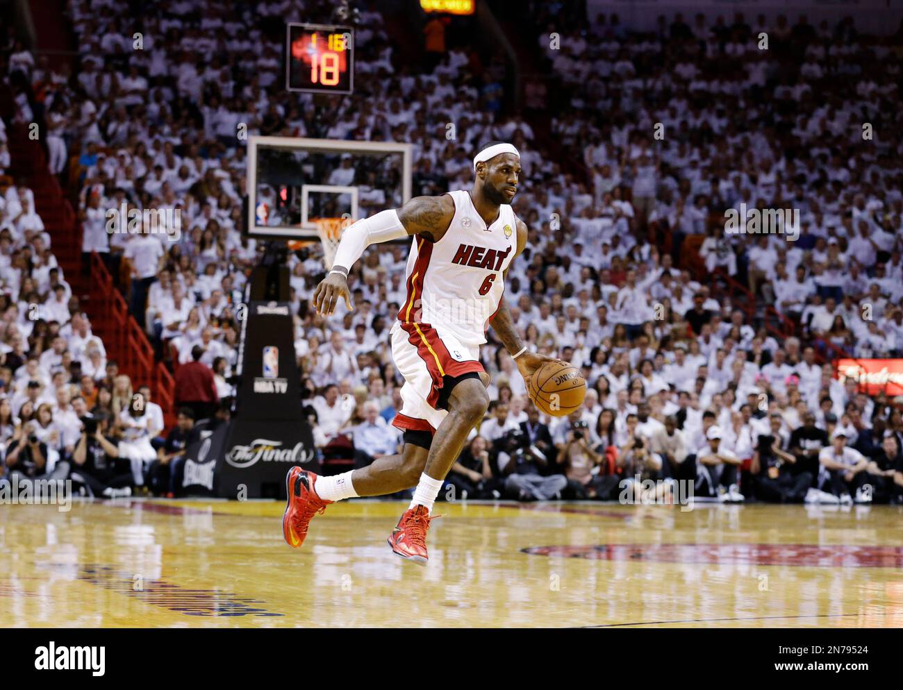 Miami Heat's LeBron James (6) takes the ball down court against the San ...