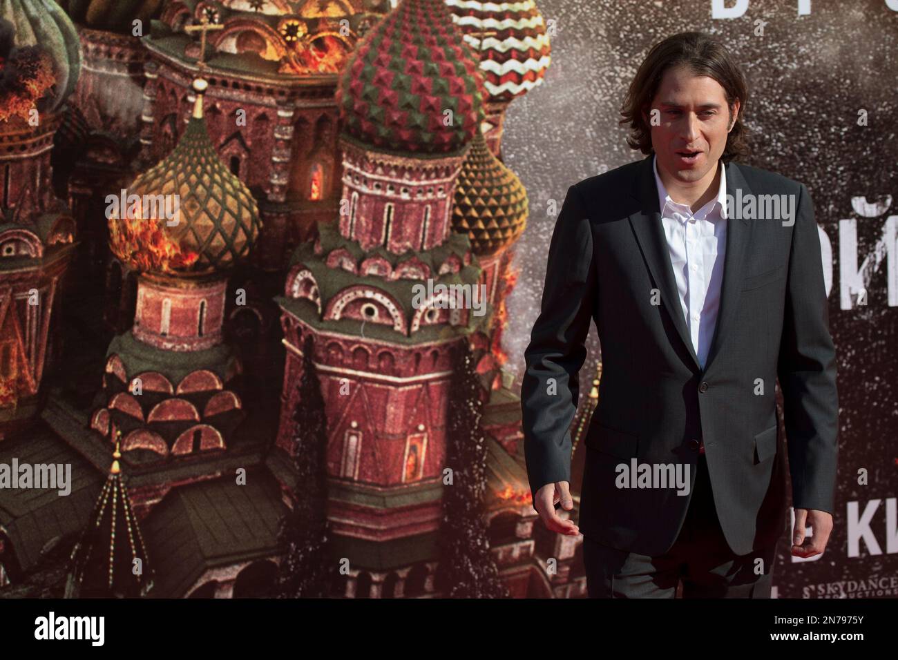 Film producer Jeremy Kleiner poses on the red carpet in front of a ...