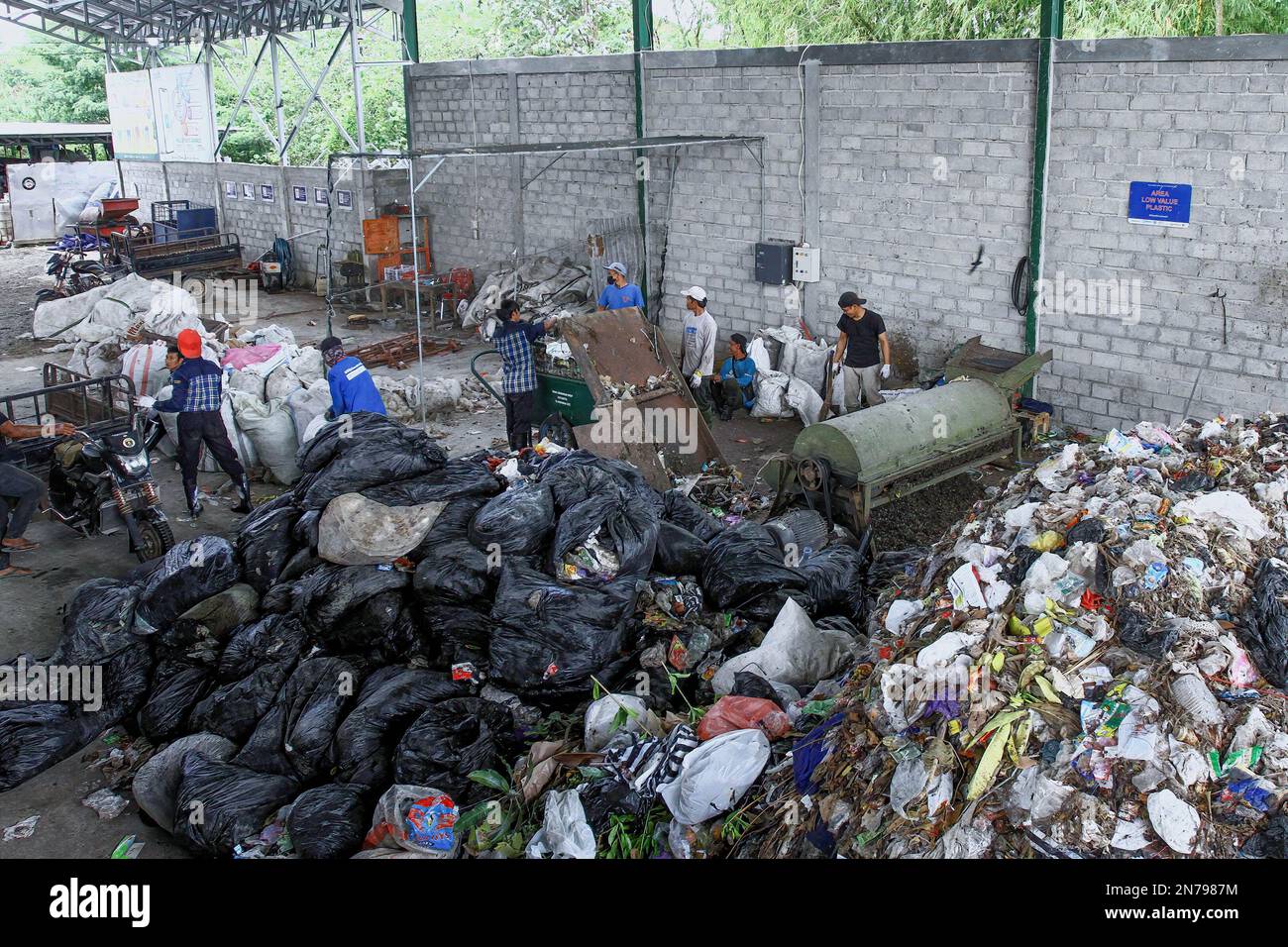 Bantul, Indonesia. 10th Feb, 2023. Workers sort waste at a waste ...