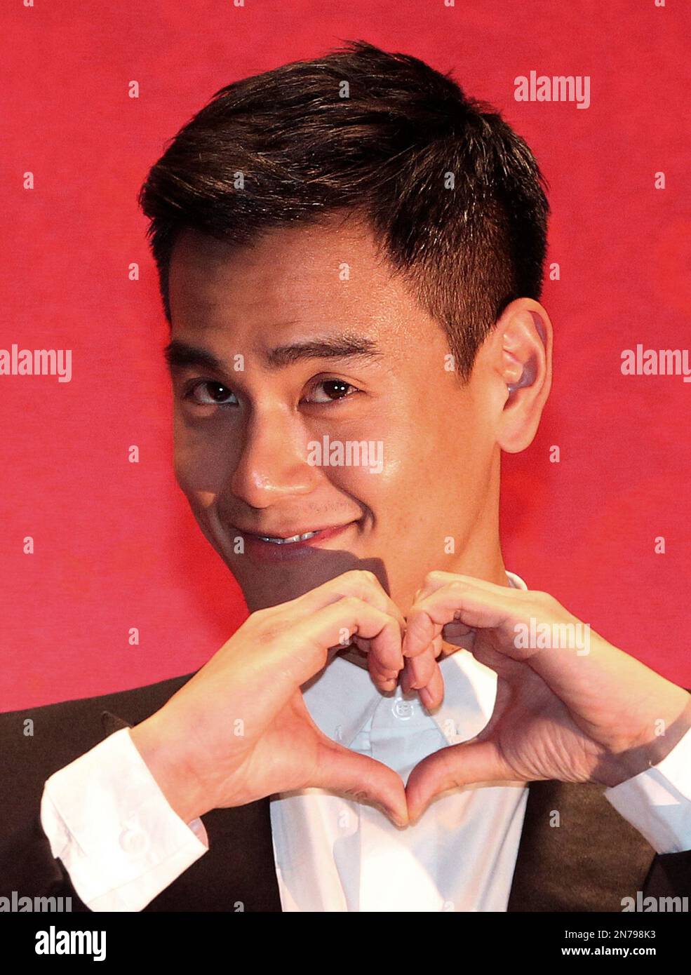 Taiwanese actor Eddie Peng gestures during a press conference to ...
