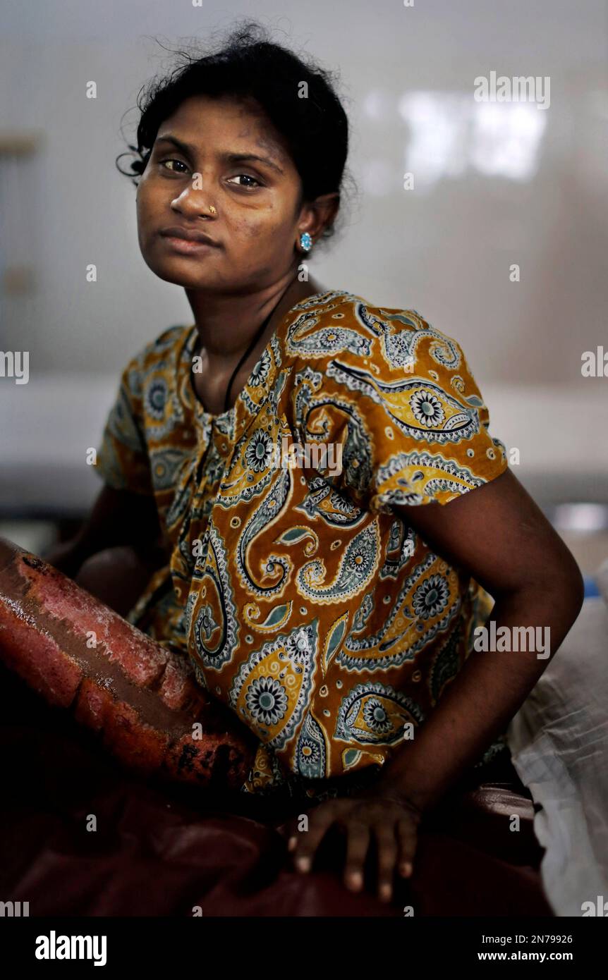 In this image taken Saturday, June 15, 2013, Bangladeshi garment worker ...