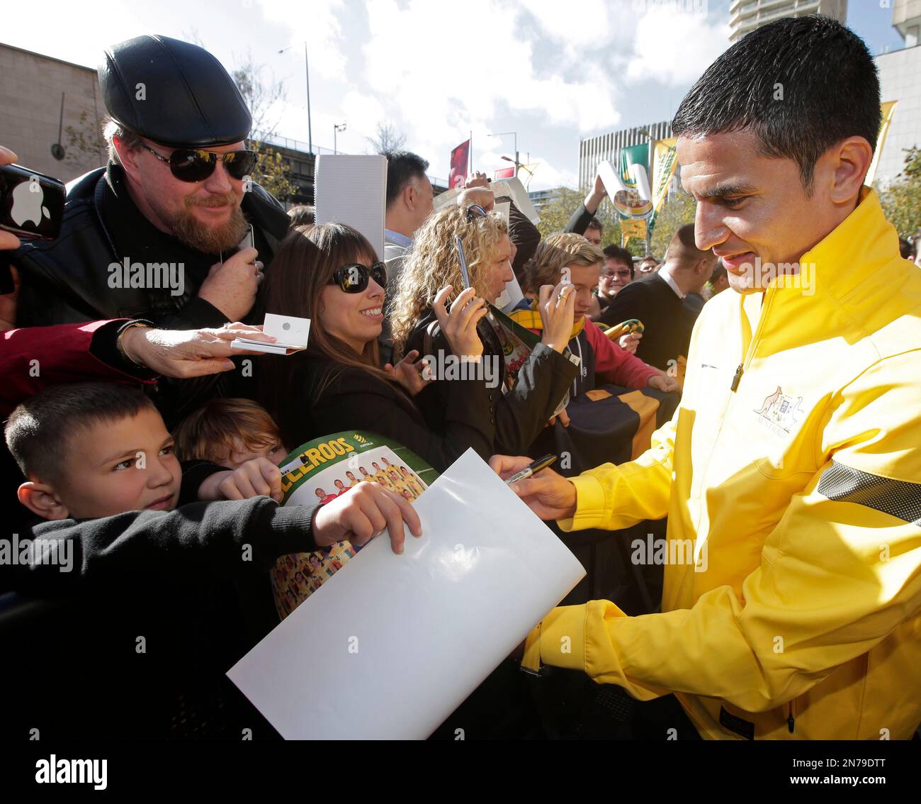 Australian national soccer player Tim Cahill, right, celebrates with ...