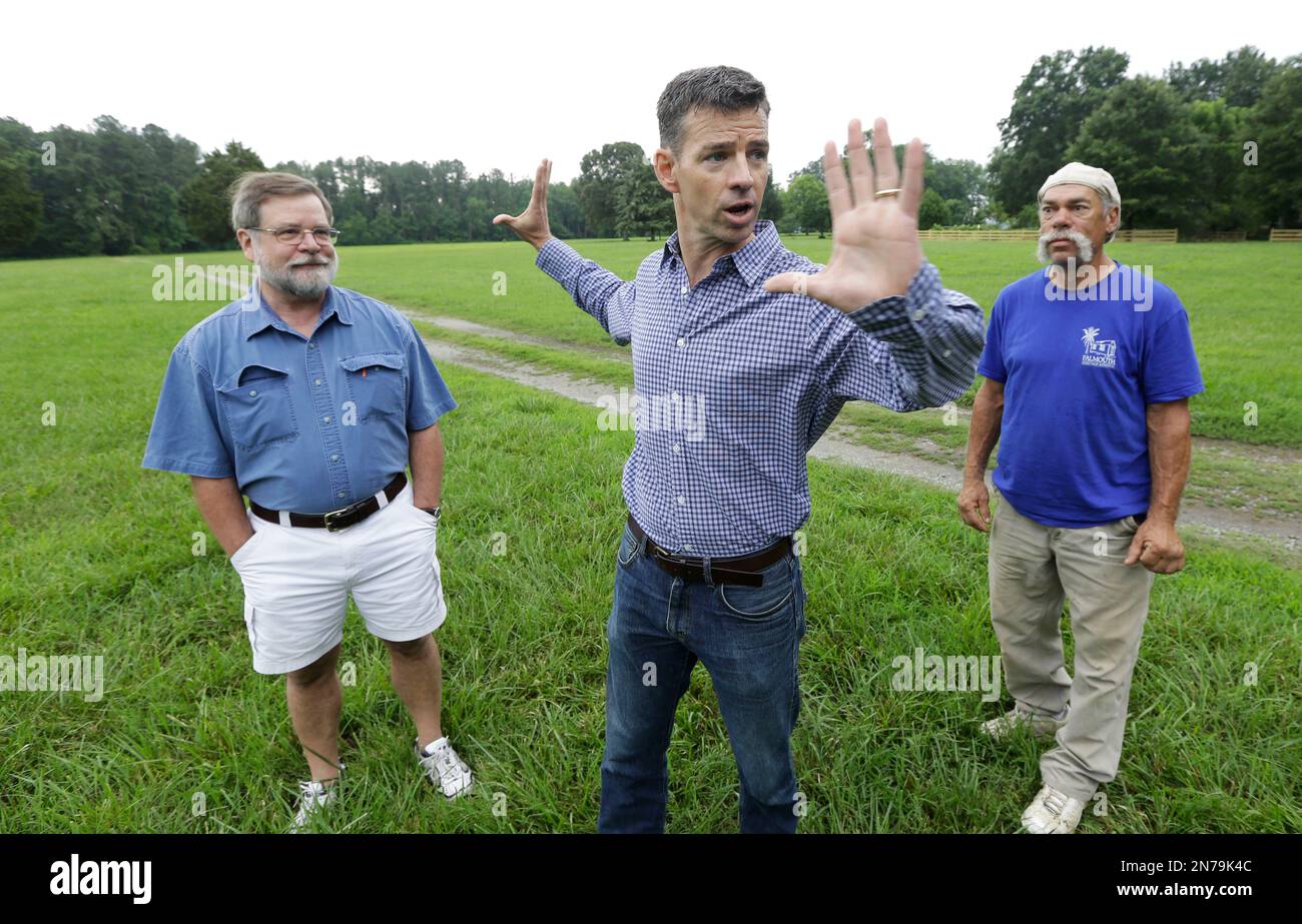 Martin Gallivan, College of William professor, center, gestures as ...