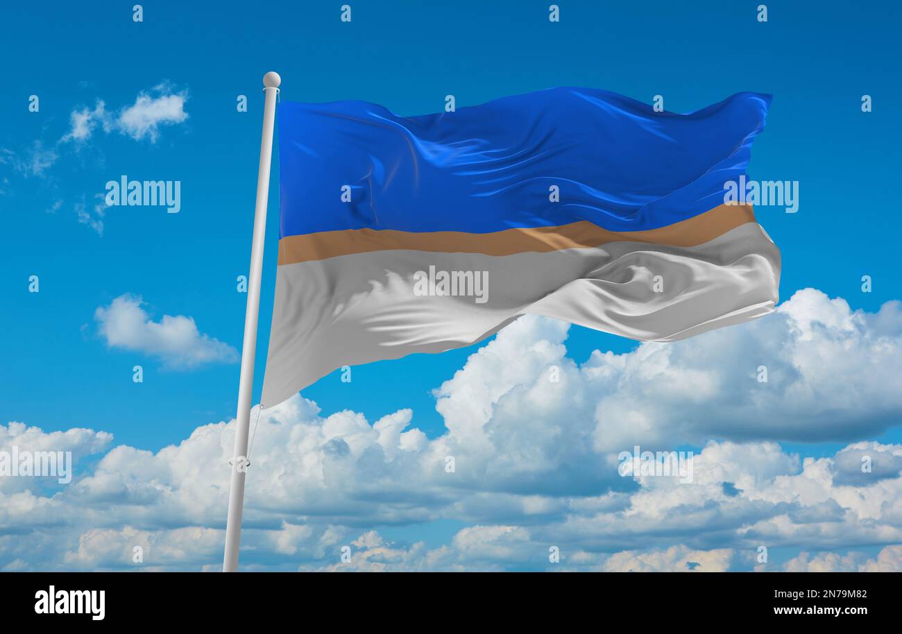 official flag of Mistissini, Quebec Canada at cloudy sky background on ...