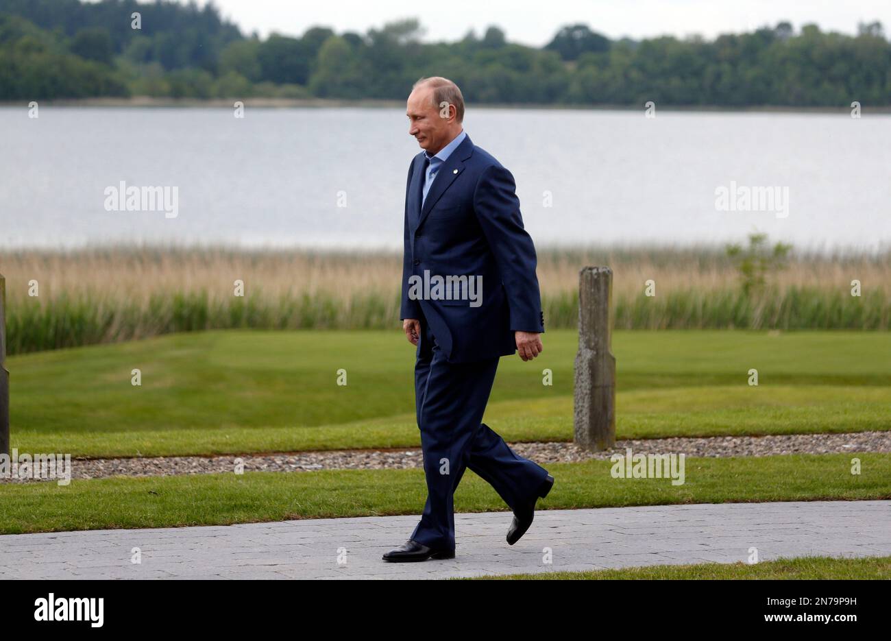 Russian President Vladimir Putin walks toward the welcome area during ...