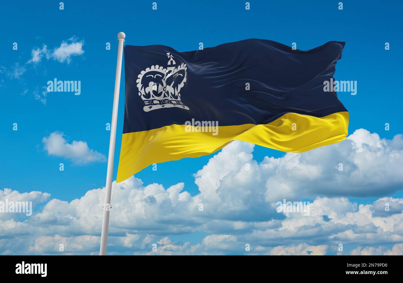 official flag of Regina Canada at cloudy sky background on sunset ...