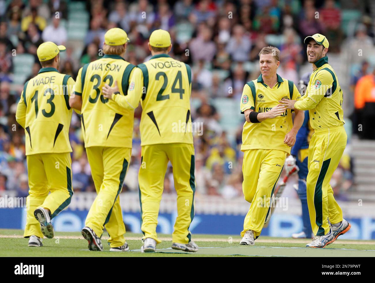 Australia's Xavier Doherty, second right, celebrates taking the wicket ...