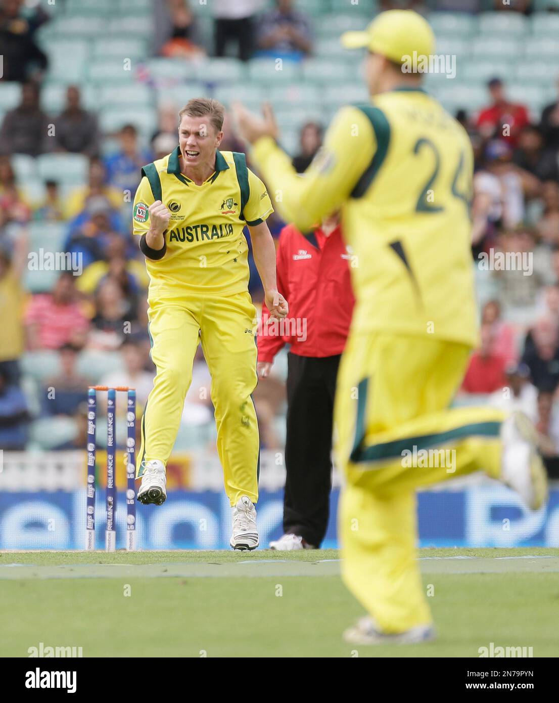 Australia's Xavier Doherty, left, celebrates after taking the wicket of ...