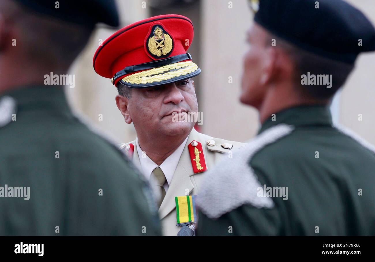 Sri Lankan army commander Lt. Gen. Jagath Jayasuriya, center, inspects ...