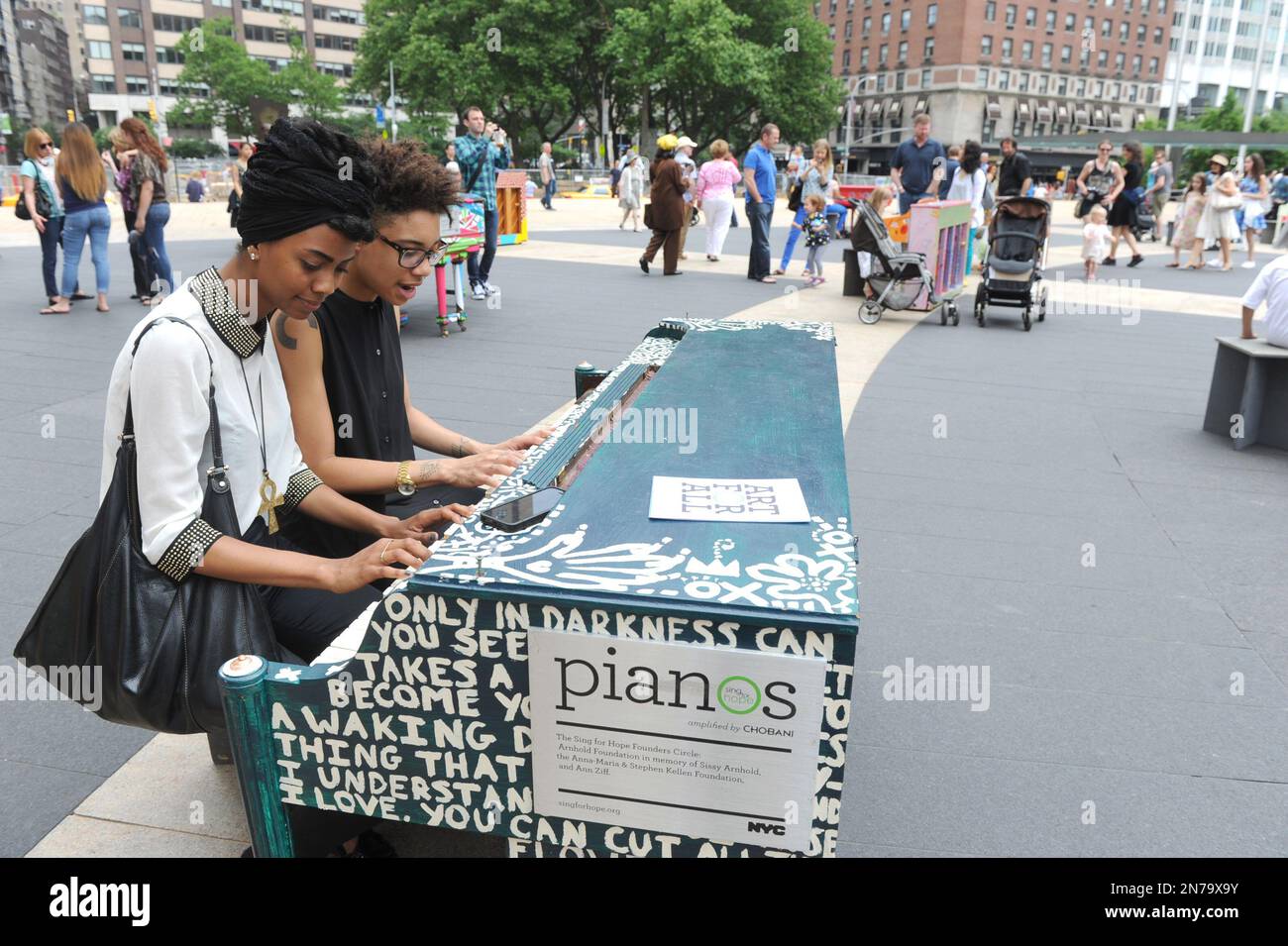 Jay Williams and Lee Bullitt, of New York, play on the piano designed ...