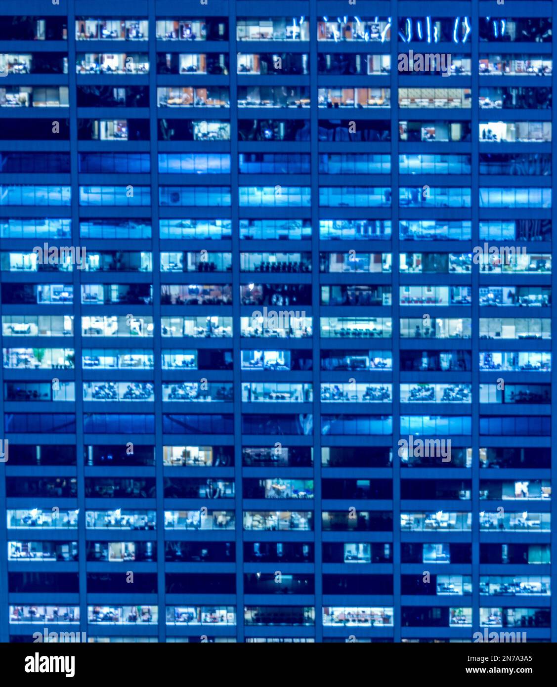 The office windows illuminated at night Stock Photo - Alamy