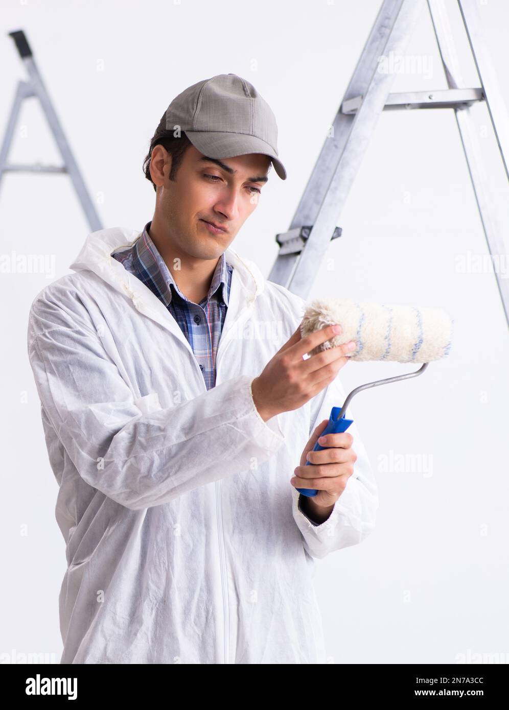 Painter working at the construction site Stock Photo - Alamy