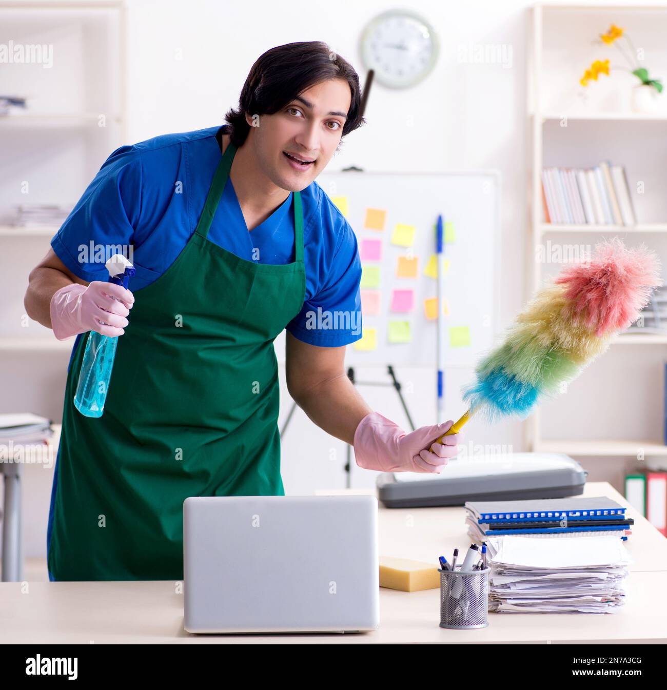 The male handsome professional cleaner working in the office Stock ...