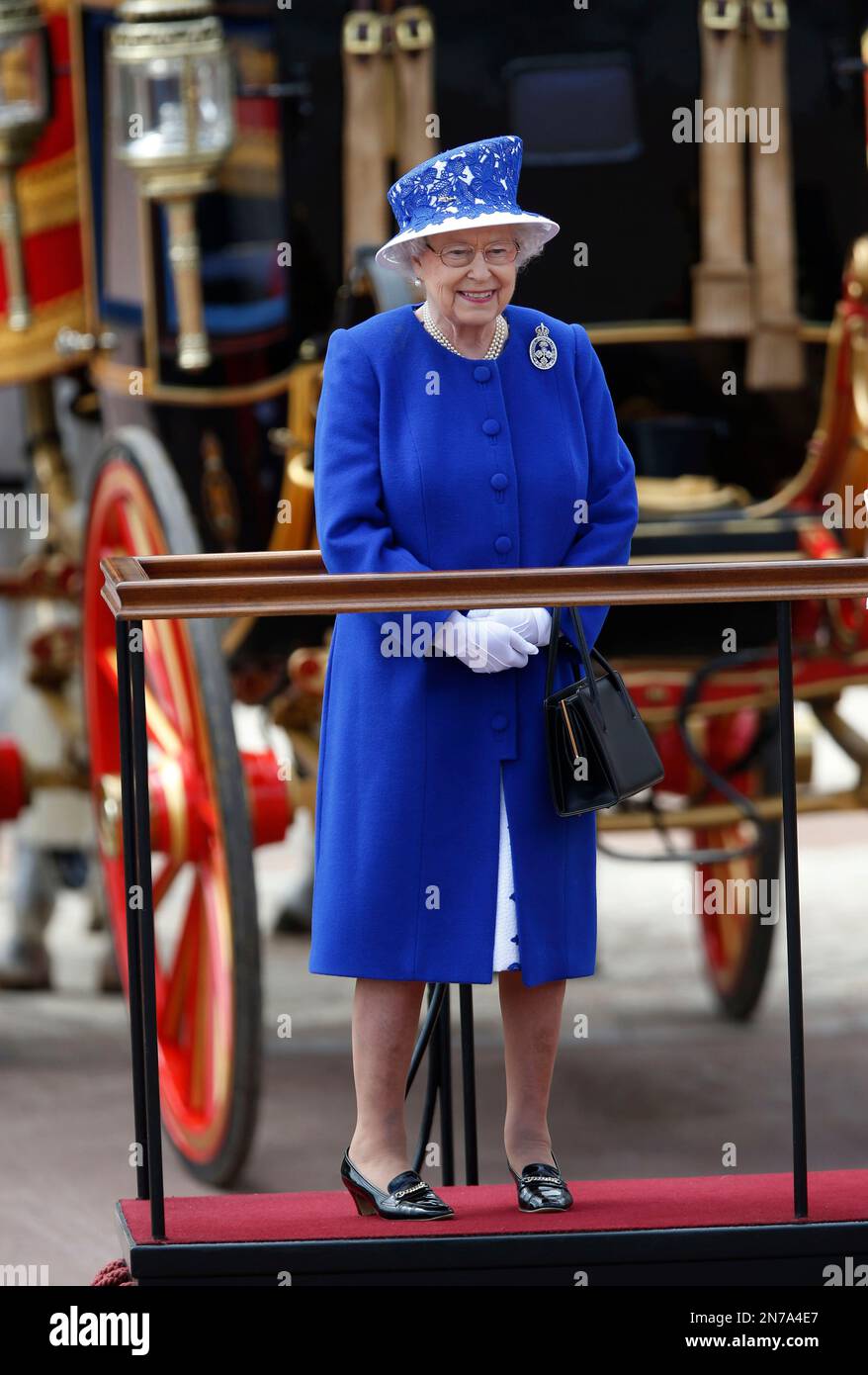 Britain's Queen Elizabeth II as the Guards march past outside Buckingham Palace after the ...