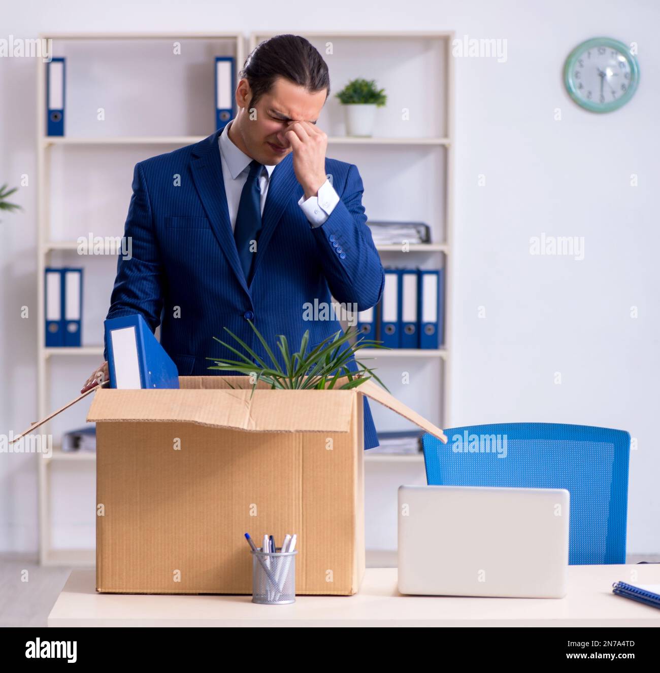 The young employee being made redundant Stock Photo - Alamy