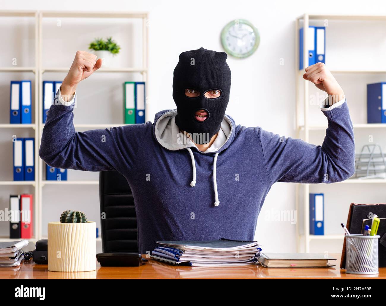 The male thief in balaclava in the office Stock Photo - Alamy